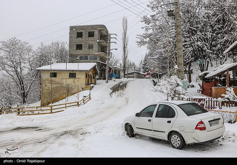 Snow Blankets Northern Iranian Tourist Village - Iran Front Page
